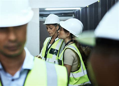 They Know What It Means To Program A Group Of Computer Programmers Working In A Server Room