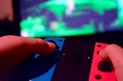 Premium Photo Close Up Of Person Hand Using Controller