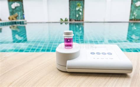 Quality Water Analysis Tool On Swimming Pool Edge With Space On Water