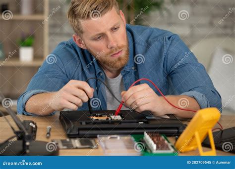 Technician Repair Laptop Using Multimeter For Voltage Measurement Stock Image Image Of Broken