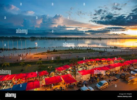A View Over The Mekong River And Night Market At The Riverside In The Laos Capital Vientiane
