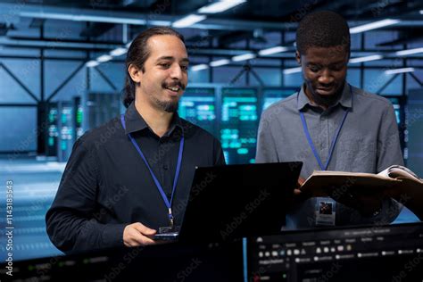 Cheerful It Specialists In Server Hub Ensuring Data Remains Shielded From Potential Threats