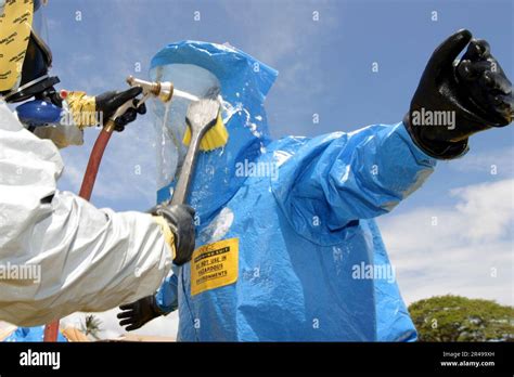 Us Navy A Survey Team Member Is Washed Down In A Decontamination Line During A Weapons Of Mass