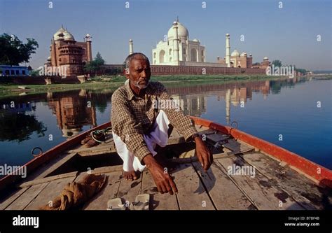 Ferry Man On His Boat On The Yamuna River Agra India Taj Mahal In