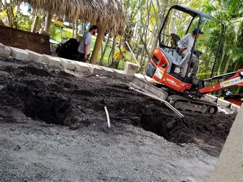 Use Of A Retaining Wall To Address Drainage And Add Patio Area