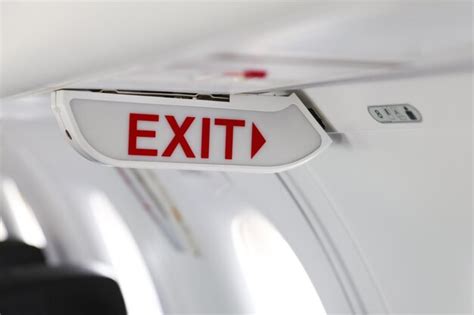 Premium Photo Exit Sign In Airplane