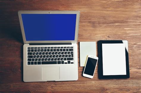 Premium Photo Modern Laptop Mobile Phone Tablet And Notebook On Wooden Table