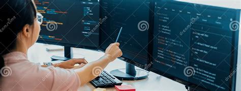 Female Programer Explain While Pointing Code Displayed On Computer