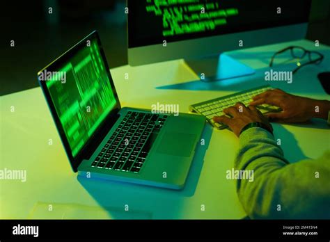 Getting Up To No Good In The Dark An Unrecognizable Hacker Cracking A