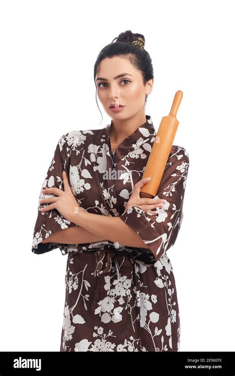 Front View Of Beautiful Young Woman Wearing Domestic Robe Holding