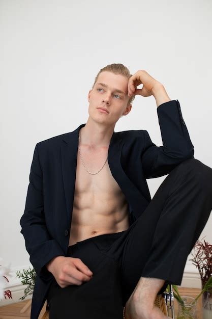 Premium Photo Front View Fit Man Sitting On Chair