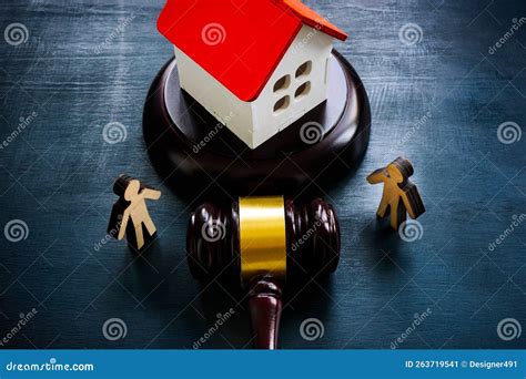 Figurines A Model Of A House And A Gavel As A Concept Of Inheritance