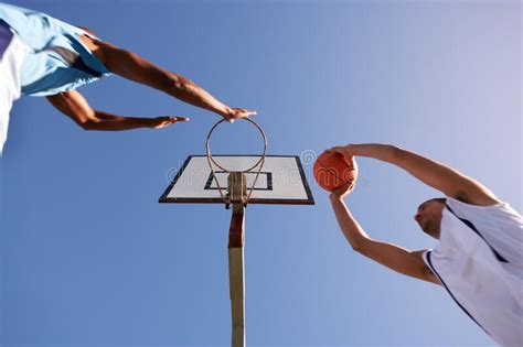 equal opponents two basketball players playing a friendly game stock