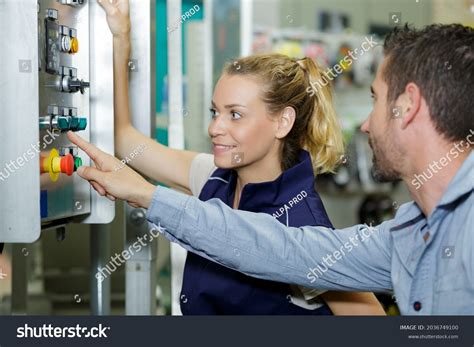 Man Showing Machinery Control Panel Female Stock Photo 2036749100 Shutterstock