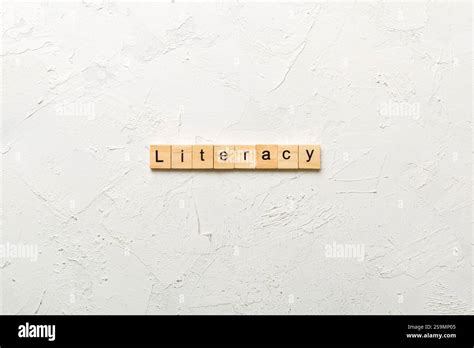 Literacy Word Written On Wood Block Literacy Text On Cement Table For Your Desing Concept