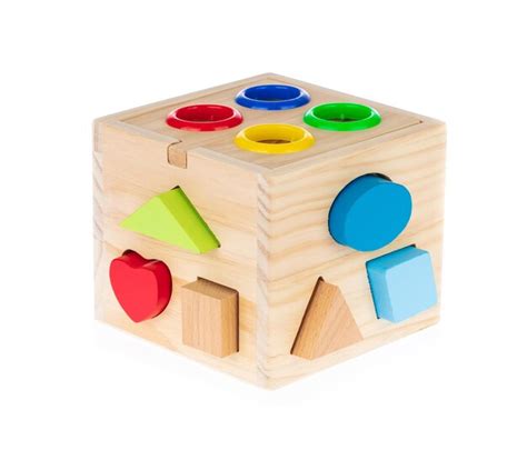 Premium Photo Wooden Cube With Folding Lid Has 12 Different Holes To