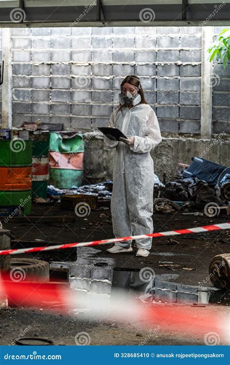 Emergency Pollution Factory Concept Female Chemist Wearing Ppe And Gas Mask Inspecting Oil On