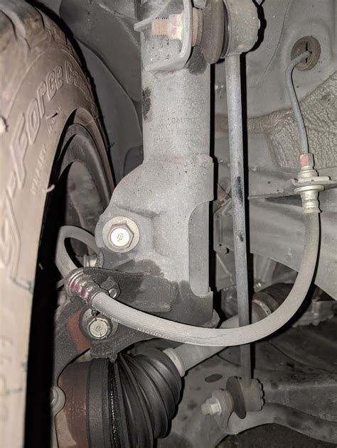 Mechanic says I have a strut issue but isnt this a torn cv boot? : r/AskMechanics