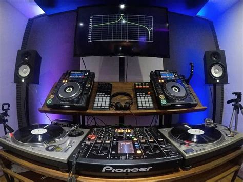 There Is A Dj Set Up In Front Of The Sound Board And Other Electronic Equipment