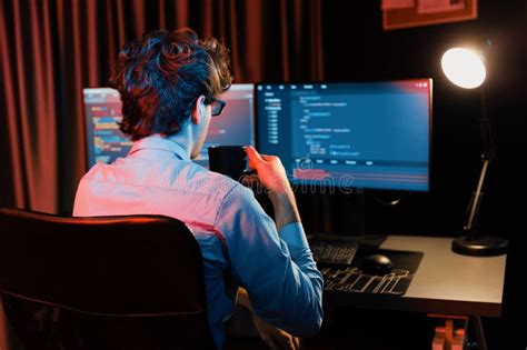 Working It Developer Concentrating Online Software At Neon Light Room