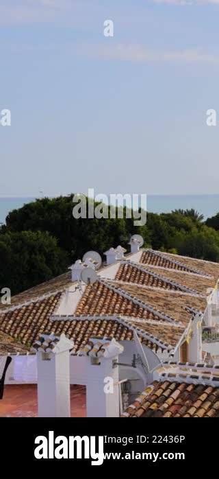 Portrait Footage From Above Of A Typical Small Spanish Apartment Block And Spanish Houses And