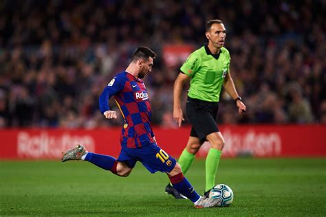 Download Messi In Action During Match Wallpaper