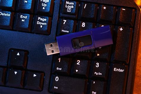 modern usb flash drive on computer keyboard top view stock image