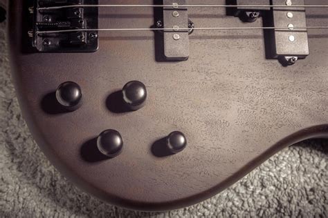 Premium Photo Bass Electric Guitar With Four Strings Closeup Detail Of Popular Rock Musical