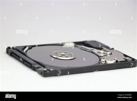 Hard Disk Drive With A View Of Its Internal Working Parts Isolated On White Background Stock