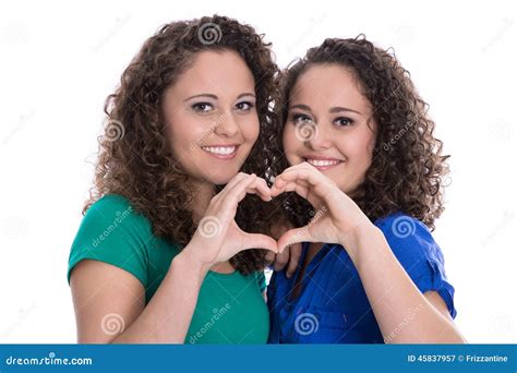 Happy Young Girls Making Heart With Hands Real Twin Sisters Stock
