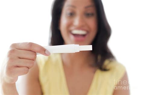 Happy Woman Looking At Pregnancy Test Photograph By Science Photo