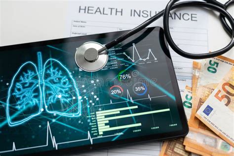 Paper With Text Health Insurance On The Table With Stethoscope Stock