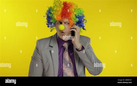 Scared Clown Manager Office Worker In Wig And Business Suit At Work