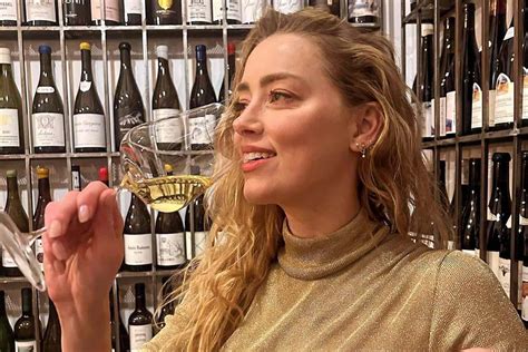 Amber Heard Sips Champagne In Rare Photo To Celebrate Her 38th Birthday