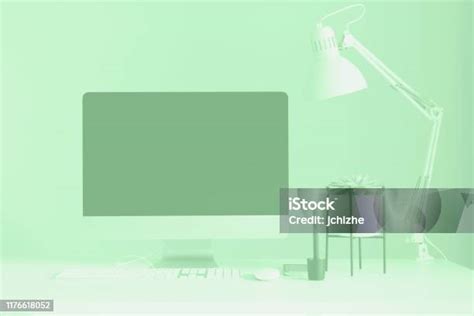 컴퓨터 키보드 마우스 모니터 그래픽 태블릿 스마트 폰 즙이 많은 식물 및 트렌디 한 민트 색상의 다른 사무 용품이있는 흰색