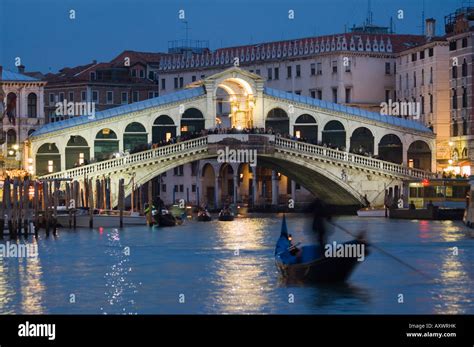 The Grand Canal The Rialto Bridge And Gondolas At Night Venice