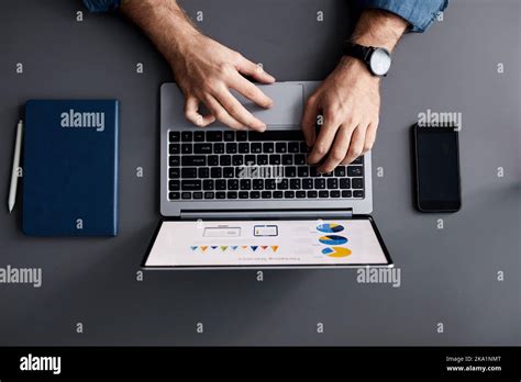 Above Shot Of Hands Of Young Businessman Over Laptop Keyboard And