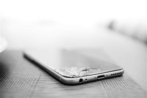 Minimalistic Crashed Iphone With Cracked Screen Free Technology Image By Picjumbo