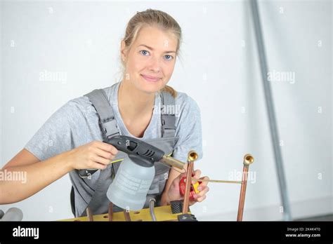 Worker Using Blowtorch For Soldering Copper Fittings Stock Photo Alamy