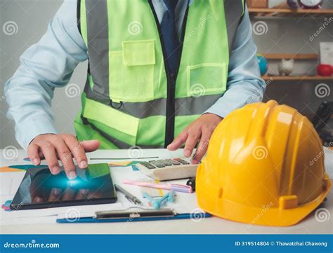 Architect Or Engineer Using Tablet To Work On Table Cost Calculation Construction Planning