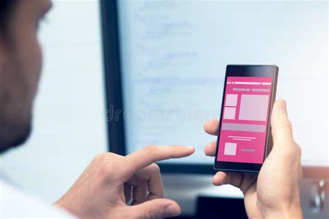 Mobile Application Development Programmer With Smartphone Stock Image