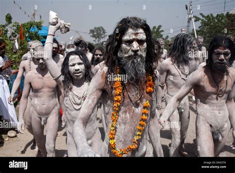 Naked Ash Smeared Sadhus With Marigold Flowers Garland On Way To River Ganges Kumbh Fair
