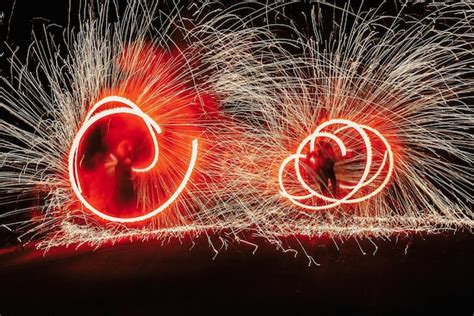 Premium Photo Fire Dancers Swing Spinning Red Fire And Man Juggling