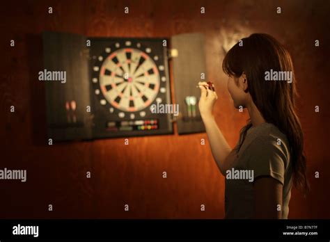 Woman Throwing Dart Hi Res Stock Photography And Images Alamy