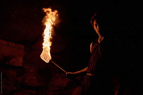 Mysterious Man Holding Torch By Stocksy Contributor Clique Images Stocksy