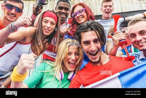 Happy Sport Supporters Having Fun During Football World Game Young
