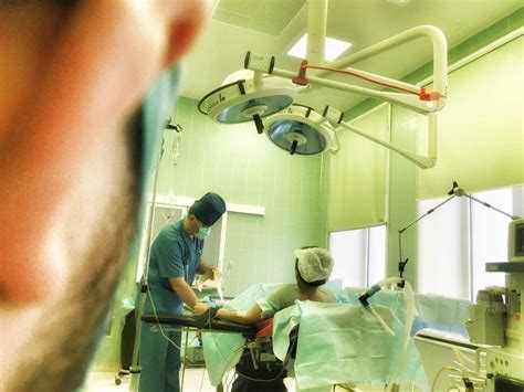 Fury As Ukraine Plastic Surgeon Poses For SELFIES With Naked Patients Unconscious On The