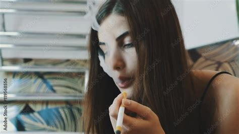 Vidéo Stock Young Girl Sit In Bathroom Tap Smartphone Smoking