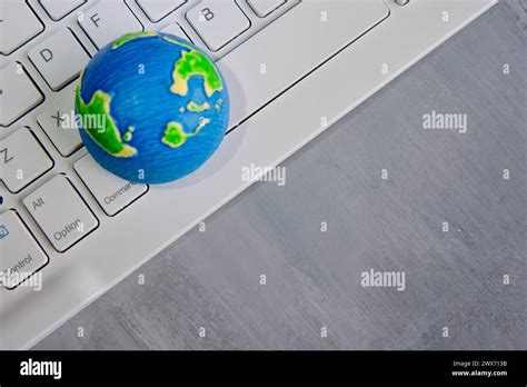 A Globe On A White Computer Keyboard With Copy Space Global Communication Computer Network
