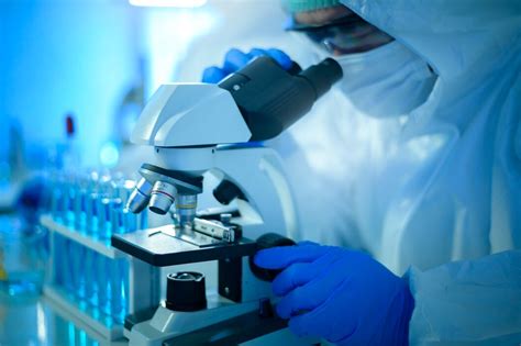 Premium Photo A Scientist Using Microscope During Experiment In